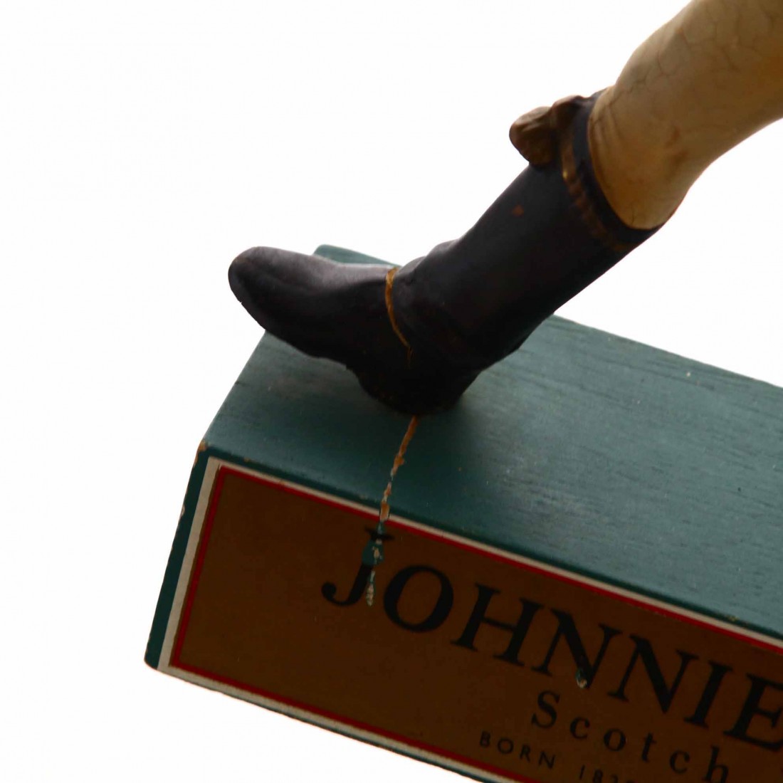 Johnnie Walker Striding Man Figure circa 1920s | Whisky Auctioneer